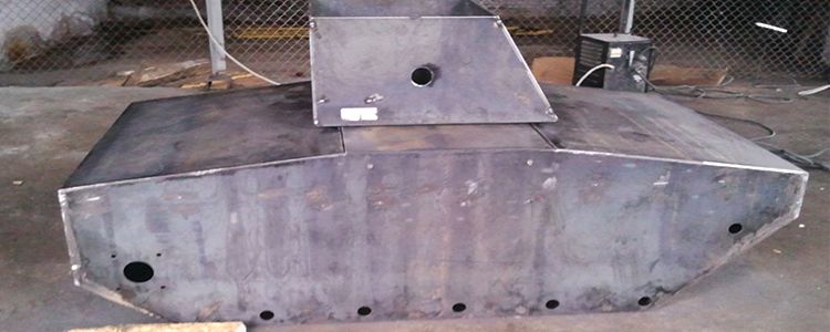 Volunteers assemble tank body - People’s Project.com